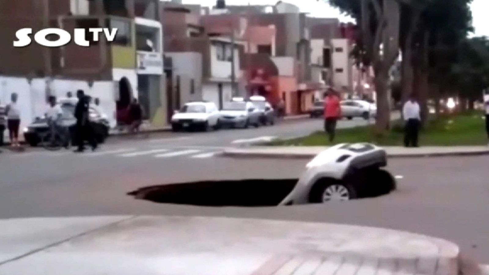 Family Rescued After Sinkhole Swallows Car | World News | Sky News