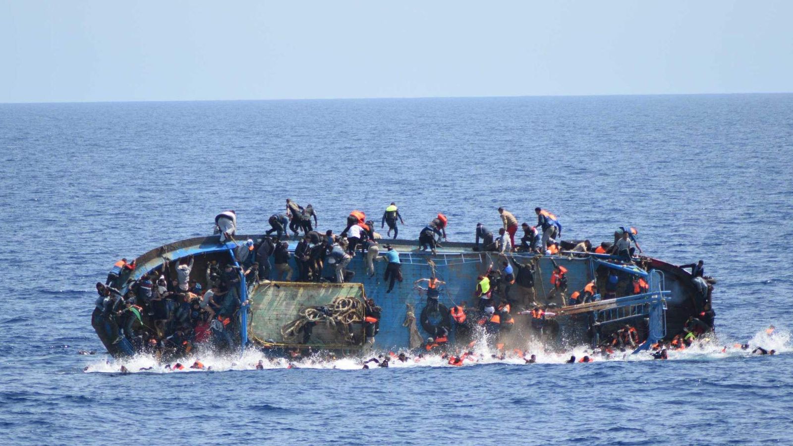 The Moment A Packed Migrant Boat Overturns | World News | Sky News