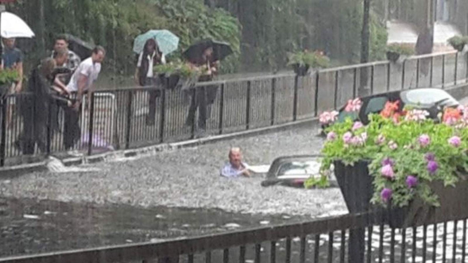Drivers Rescued After Floods Submerge Cars | UK News | Sky News