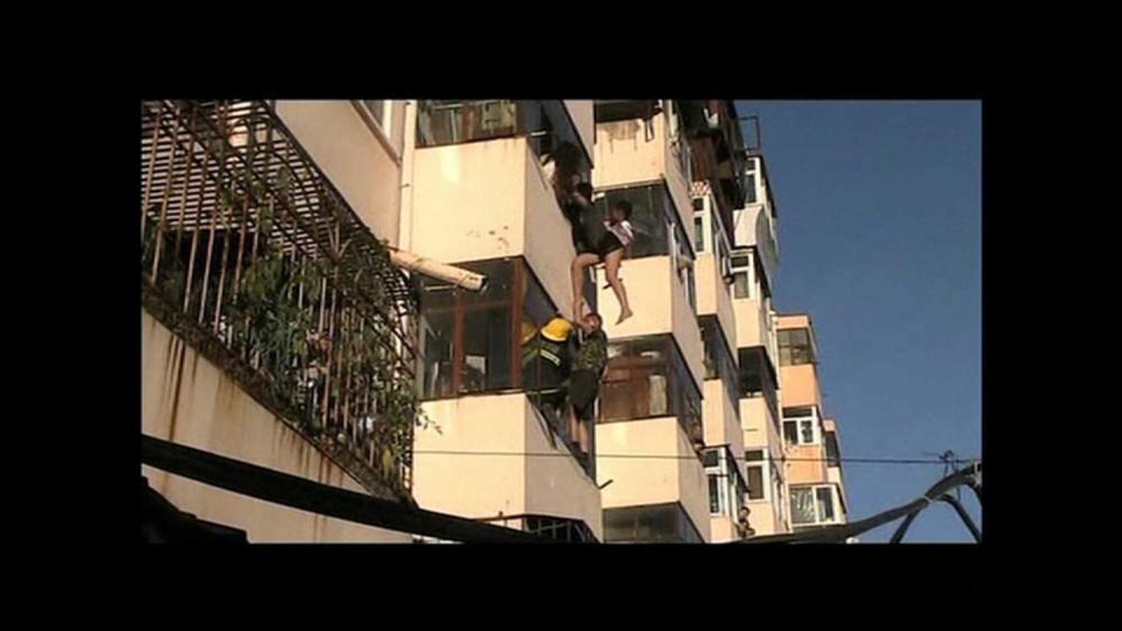 Balcony Fall: Couple Rescued In China | World News | Sky News