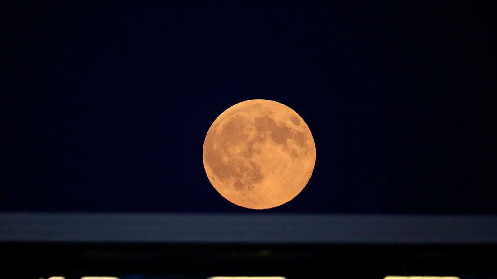 First Of Three 'Supermoons' Appears In Skies | World News | Sky News