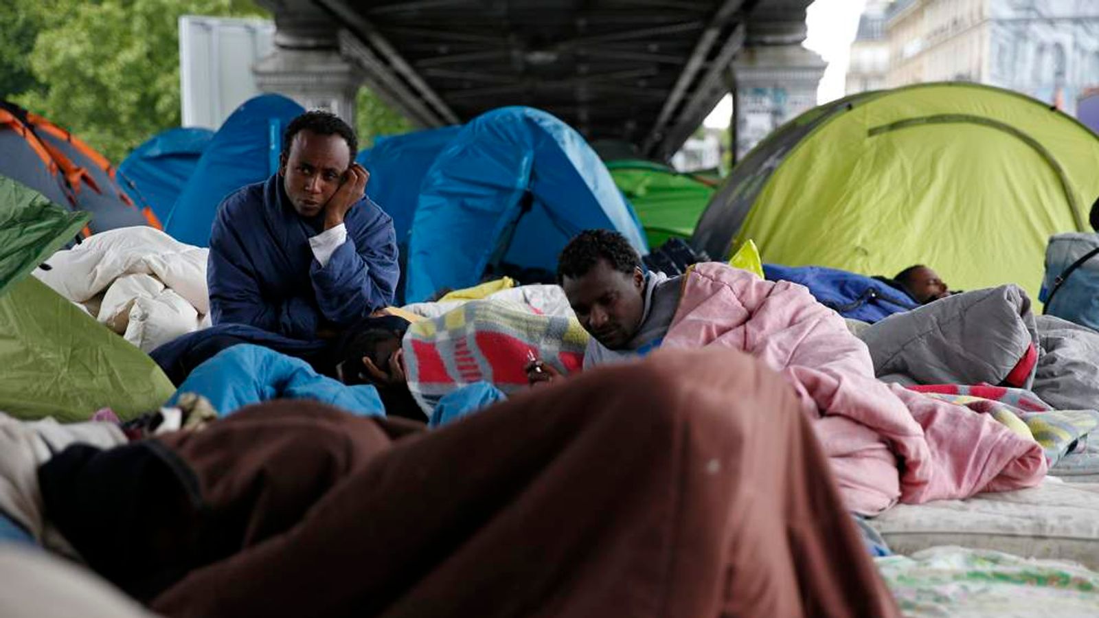 French Clear Migrant Camps In Paris And Calais | World News | Sky News