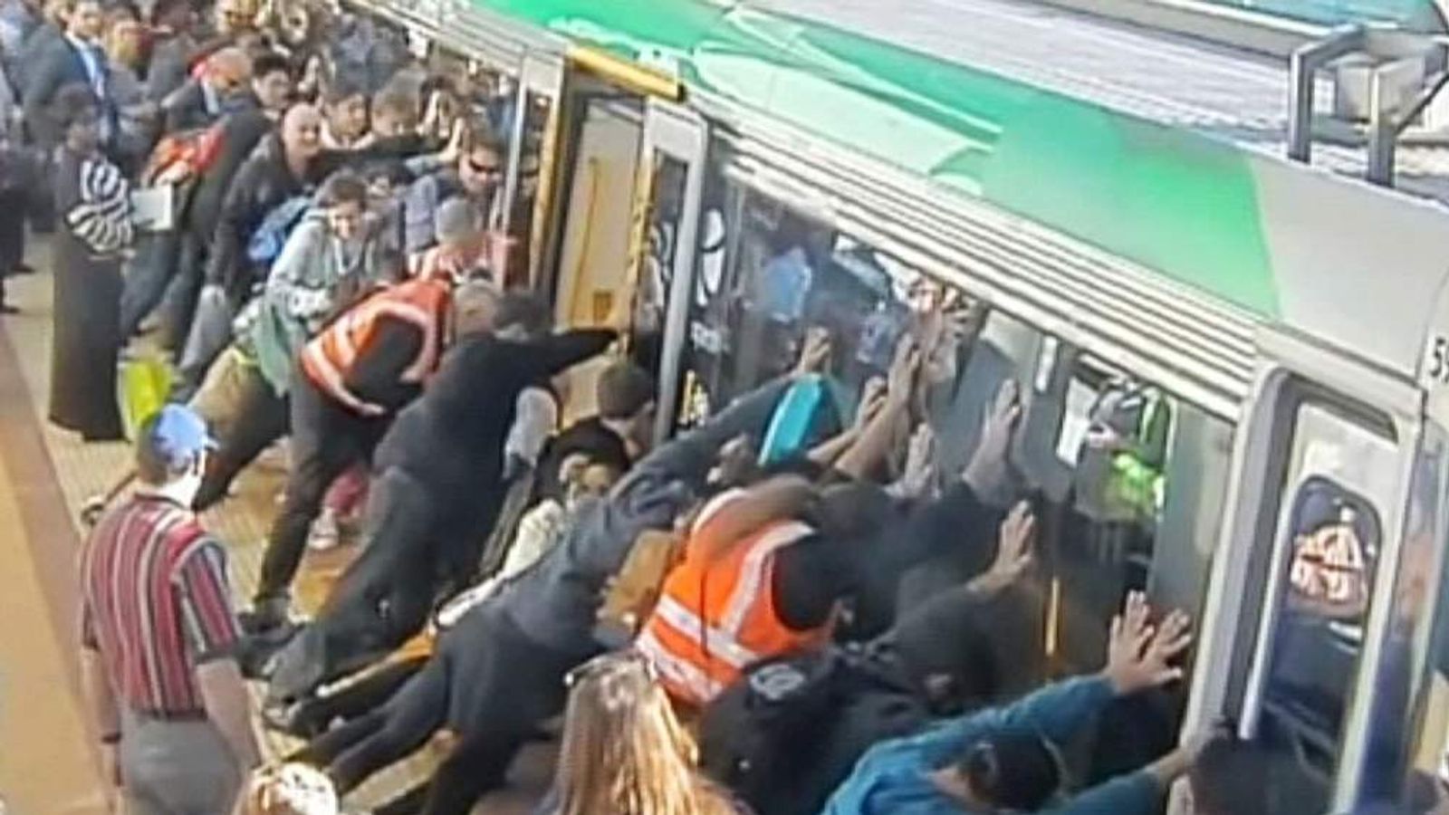 Commuters Push Train Off Trapped Passenger | World News | Sky News