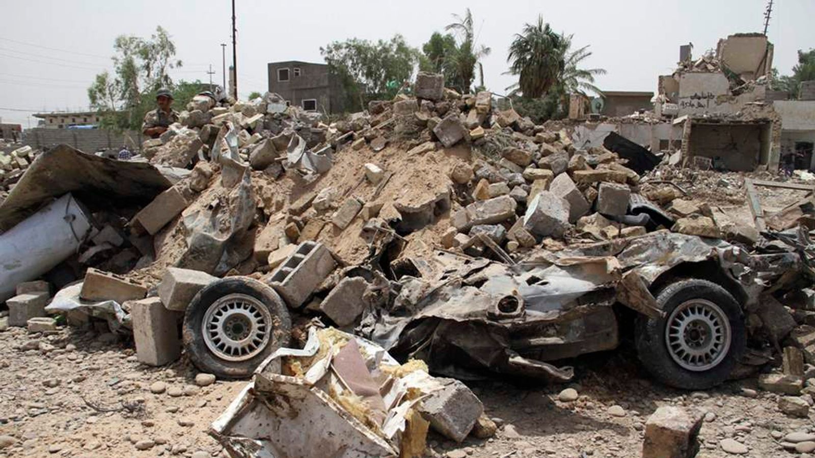 Twin Explosions Kill 18 Near Iraqi Capital | World News | Sky News