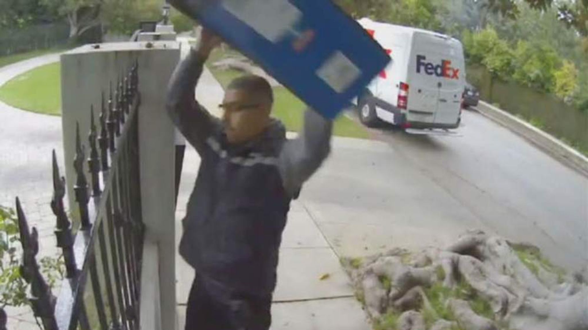 CCTV: Delivery Man Throws Monitor Over Fence | Scoop News | Sky News