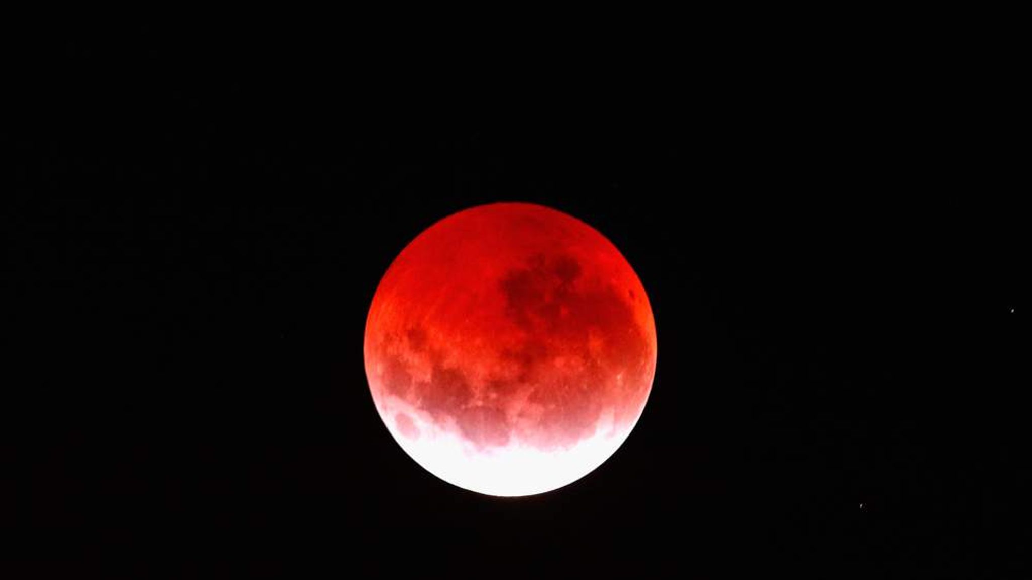 Moon Bathed In Red Light During Brief Eclipse | World News | Sky News