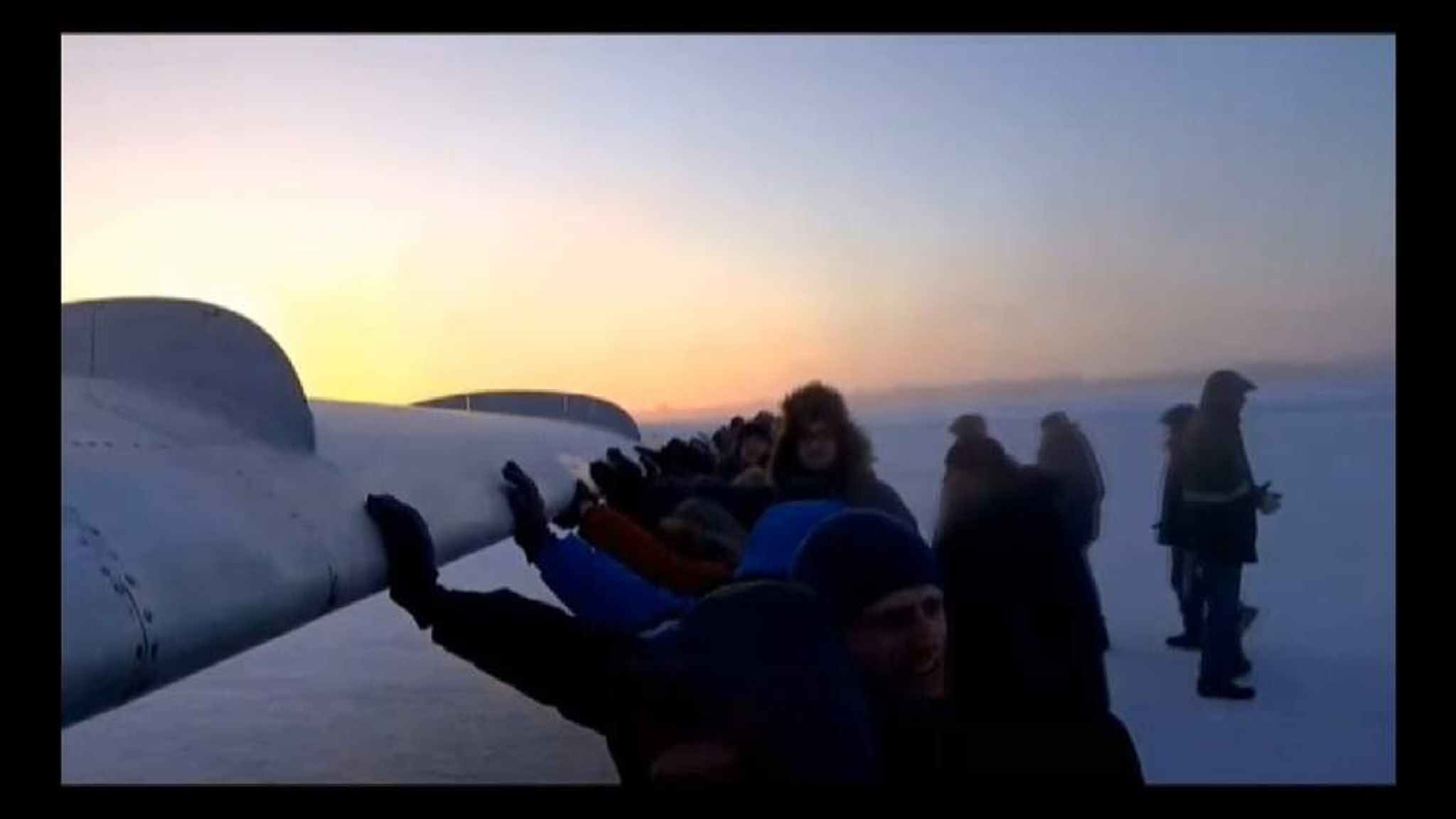 Passengers Push Broken Jet On Freezing Runway | World News | Sky News