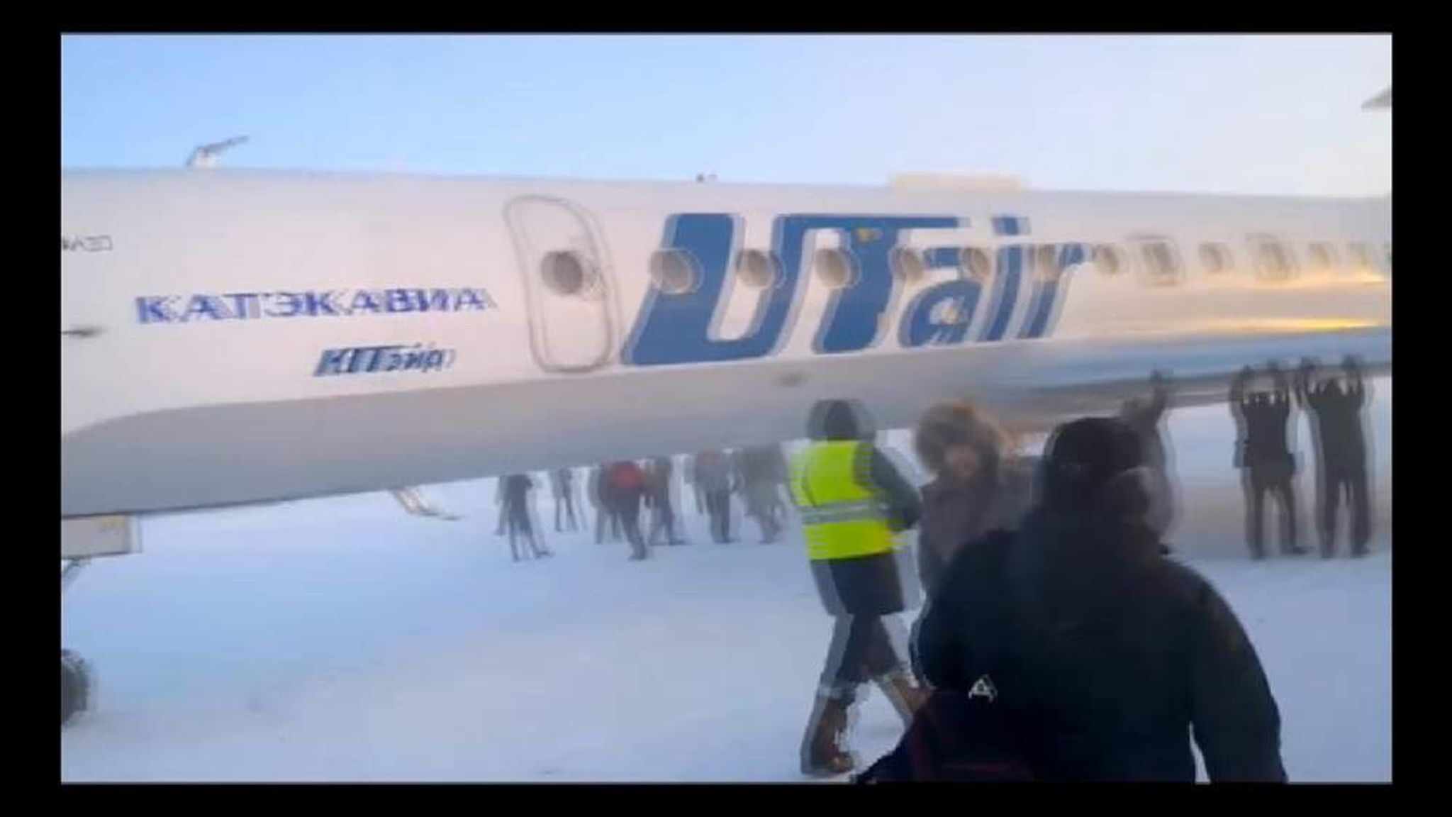 Passengers Push Broken Jet On Freezing Runway | World News | Sky News