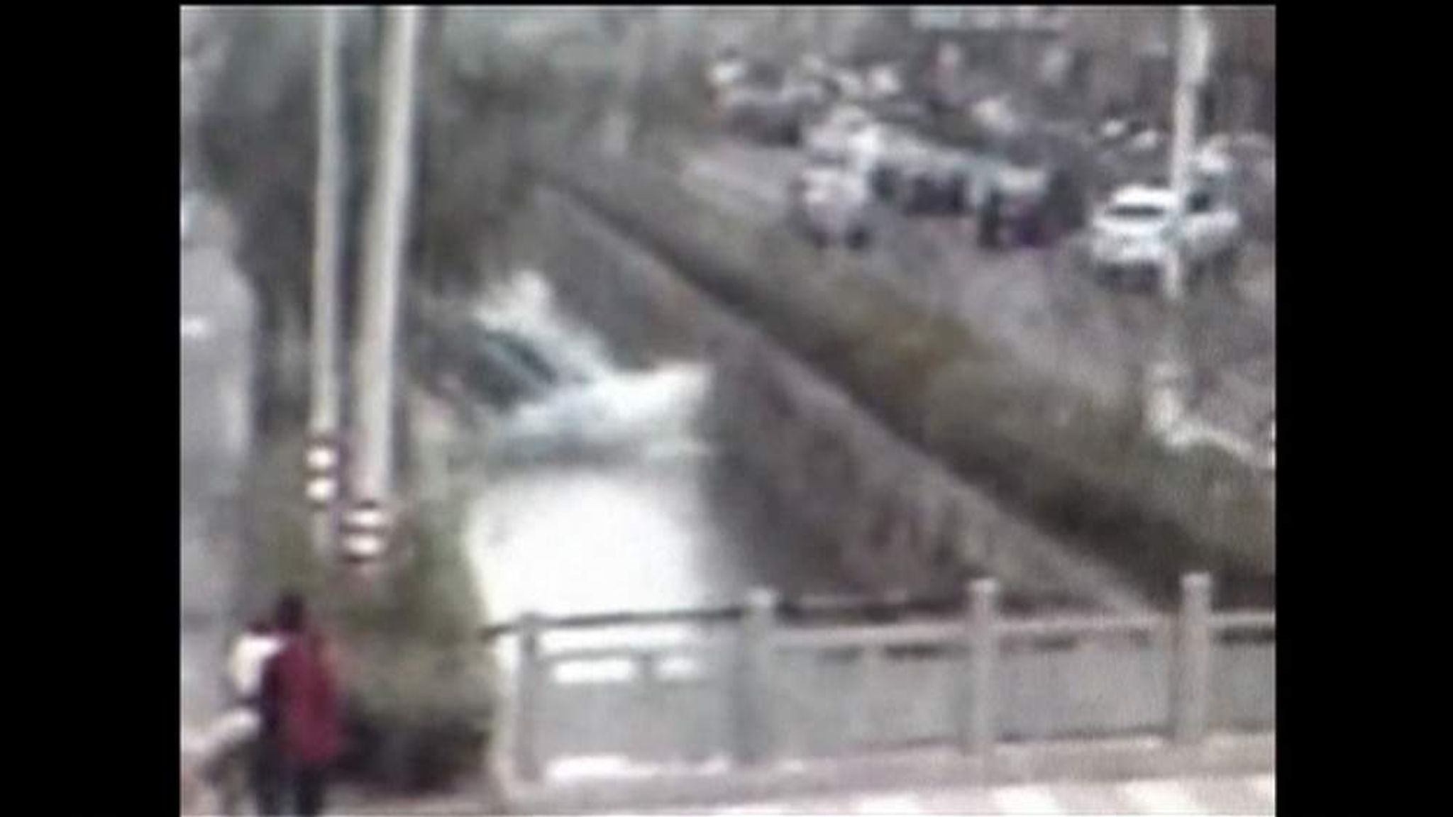 CCTV Shows Woman Crashing Car Into River | World News | Sky News