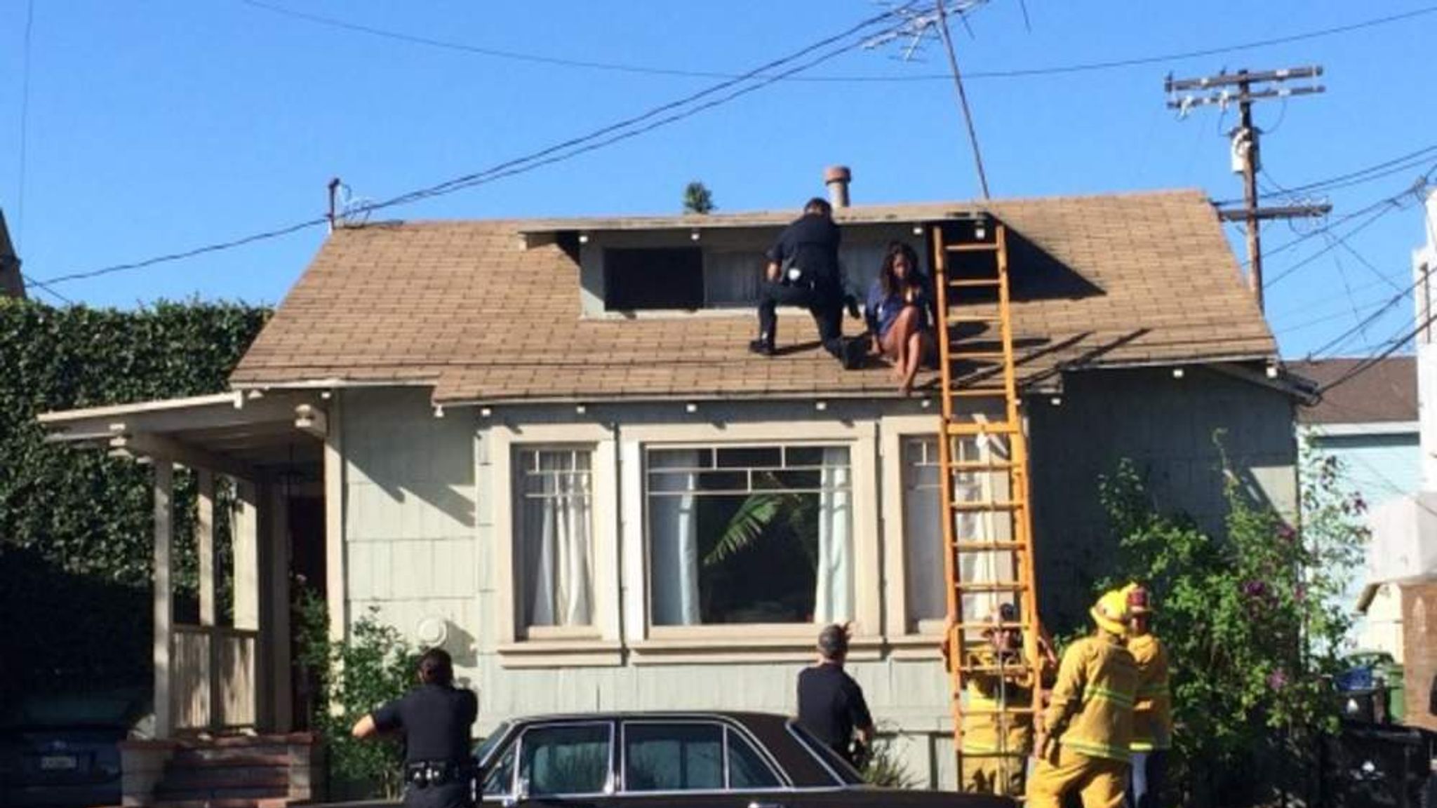 Woman Hides On House Roof To Escape Intruder | US News | Sky News