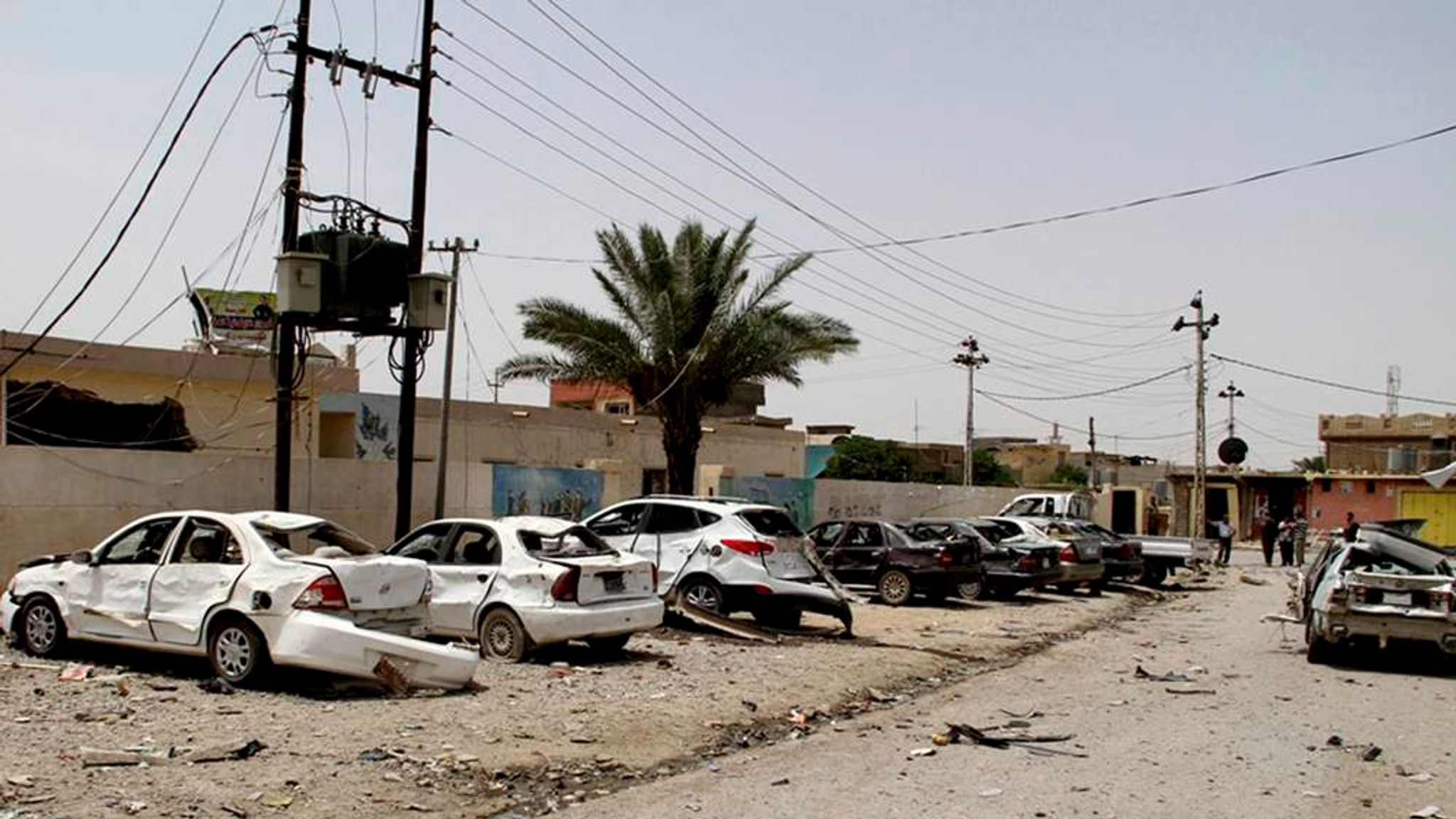 Twin Explosions Kill 18 Near Iraqi Capital | World News | Sky News