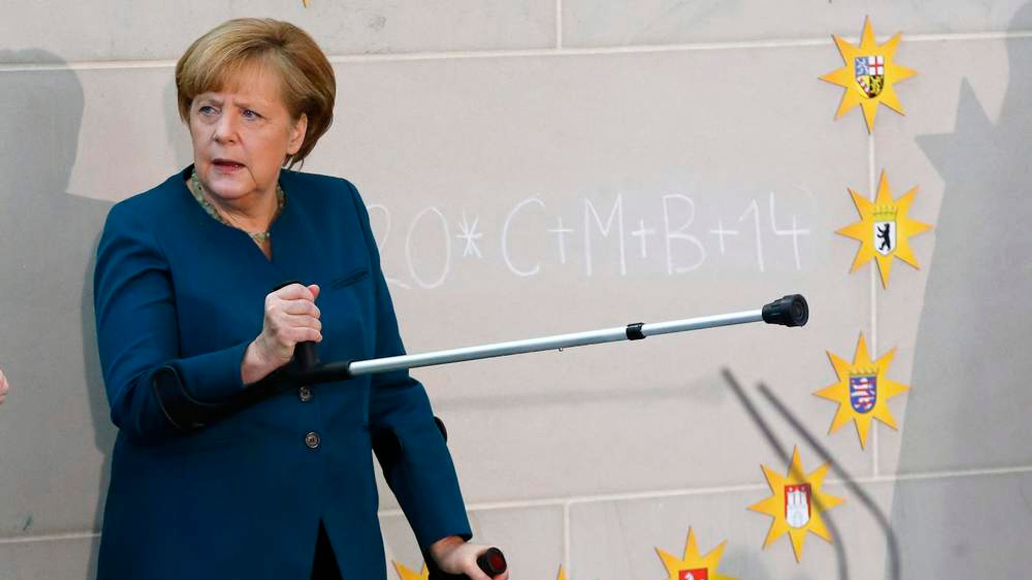 Merkel Sings On Crutches After Ski Accident | World News | Sky News