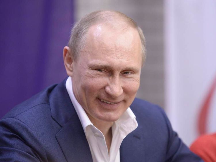 Putin Finds Time For A Laugh During Phone-In