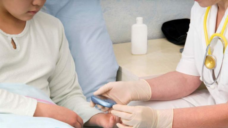 Child Having Blood Sugar Level Test Child Having Blood Sugar Level Test