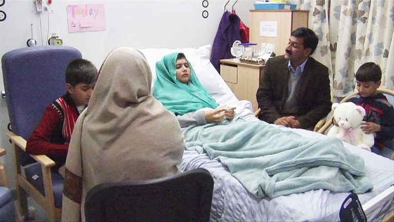Malala Yusufzai in hospital with her father Ziauddin and family.