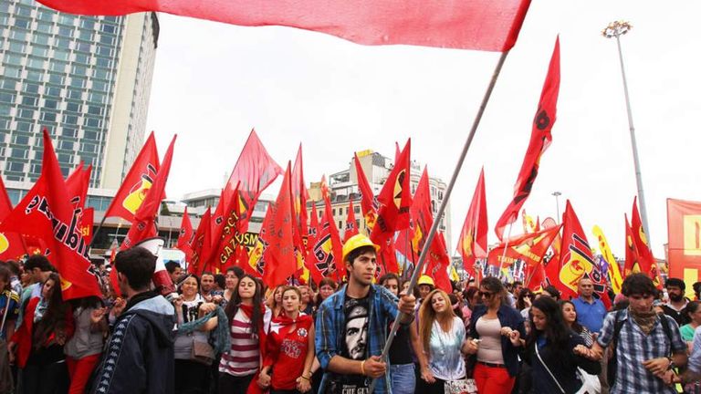 Protesters wave flags as others dance during the third day of ...