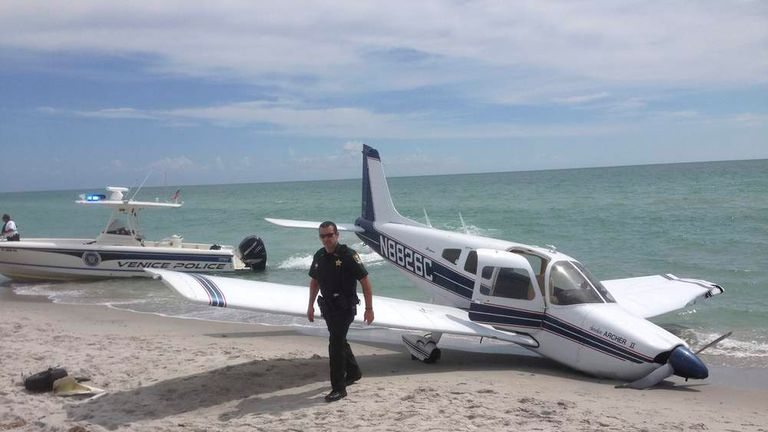 First responders at the scene of a single engine Piper Cherokee plane ...