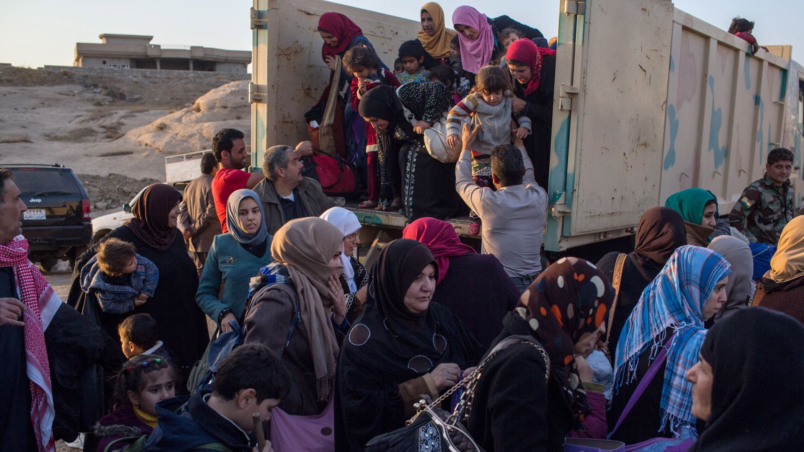 Mosul refugees gather in a dusty sanctuary near the frontline | World ...
