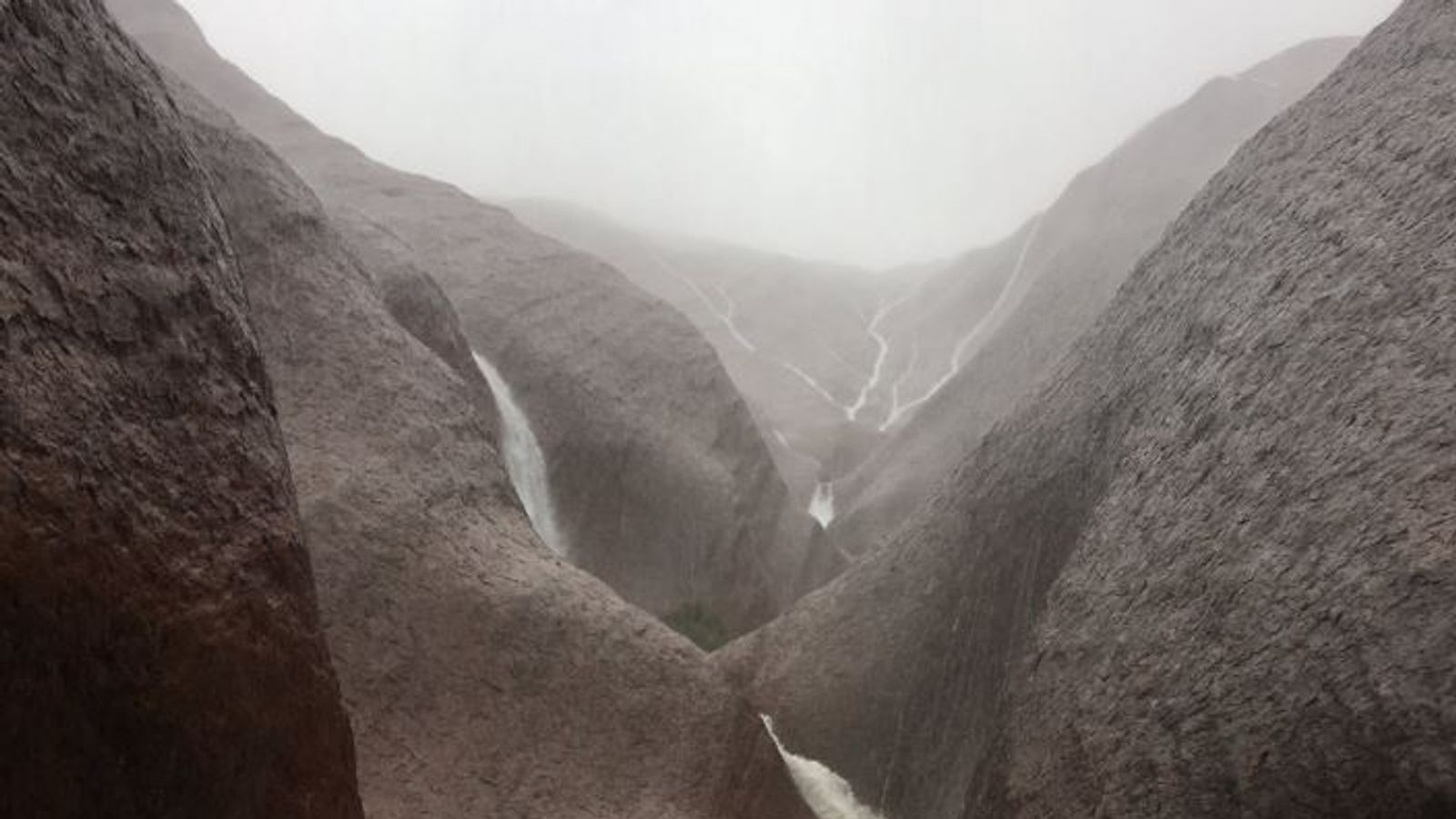Stunning waterfalls on Uluru after freak storm hits the Australian rock ...