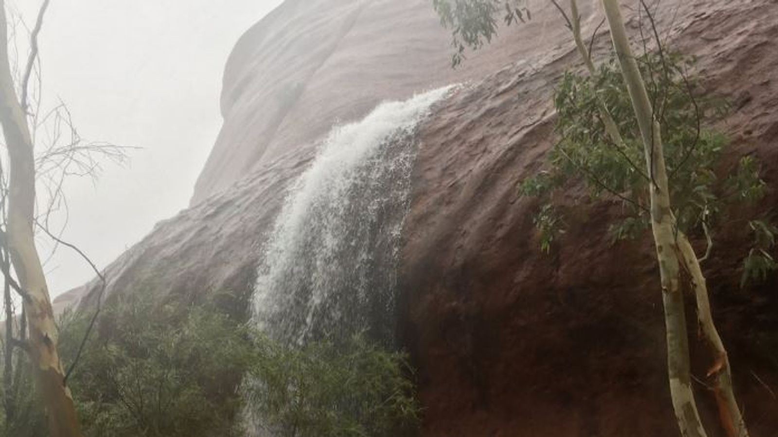 Stunning waterfalls on Uluru after freak storm hits the Australian rock ...