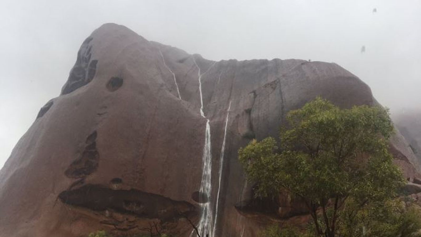 Stunning waterfalls on Uluru after freak storm hits the Australian rock ...