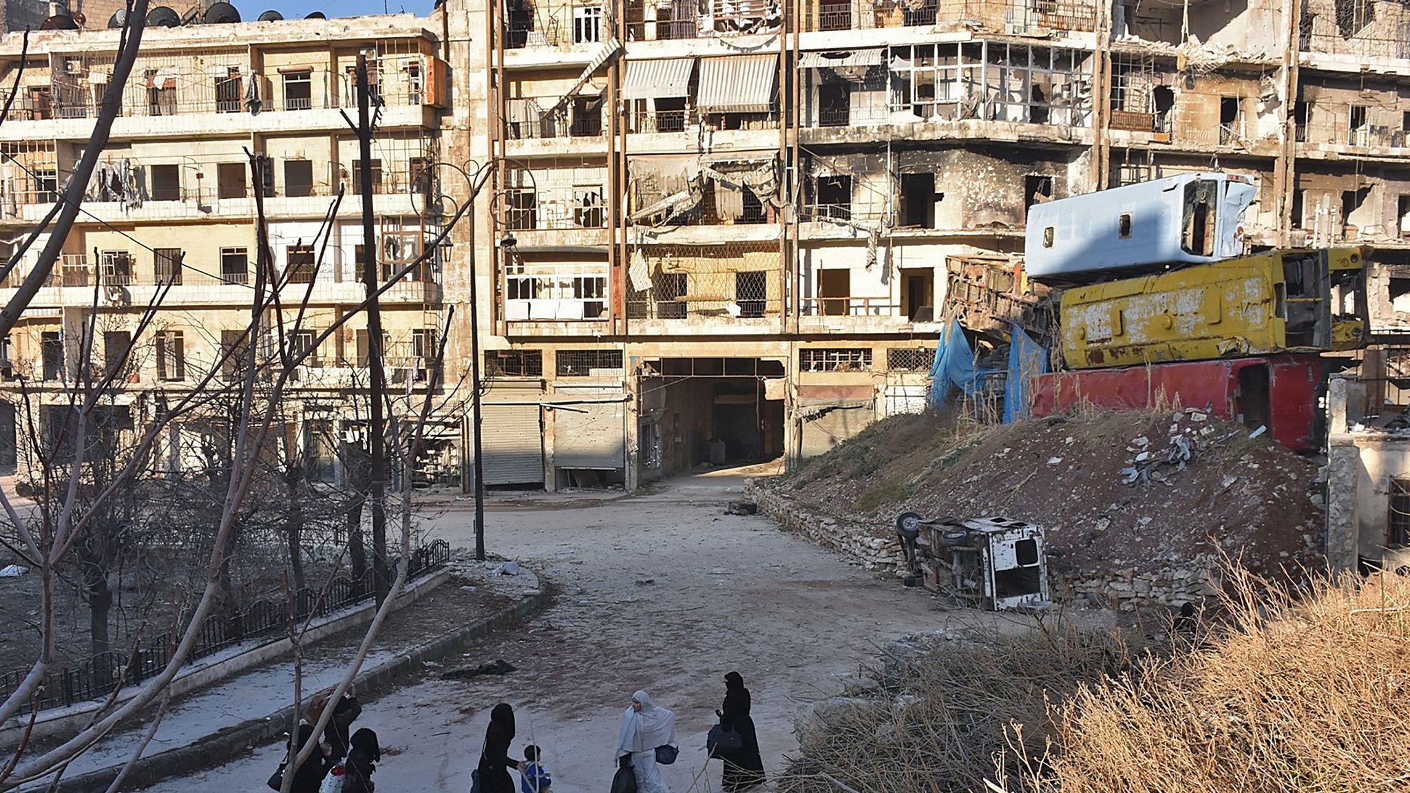 Aleppo: More than 100 children trapped in a building which is under ...