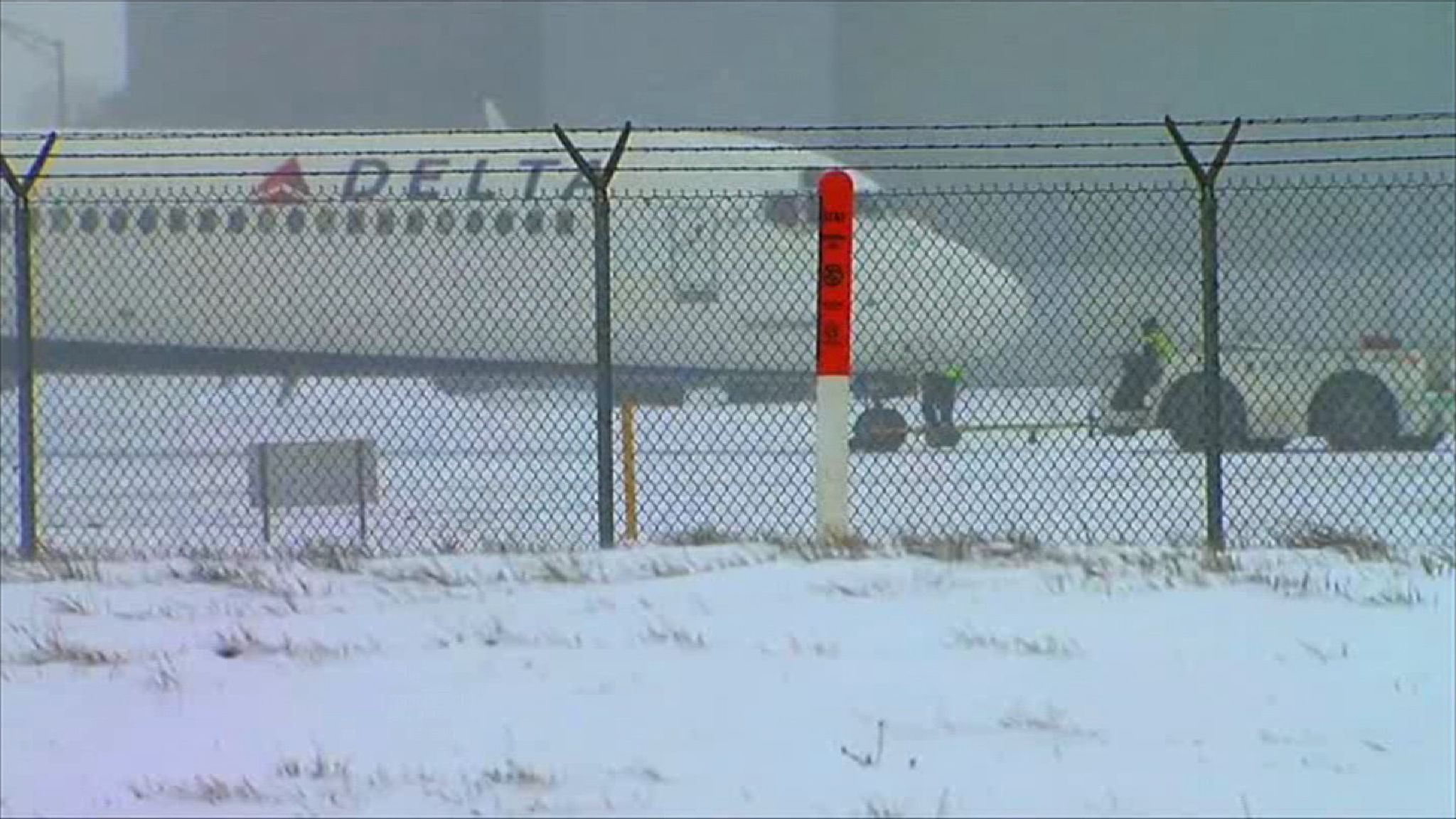 Plane slides off runway as a snowstorm sweeps across US Midwest | World ...