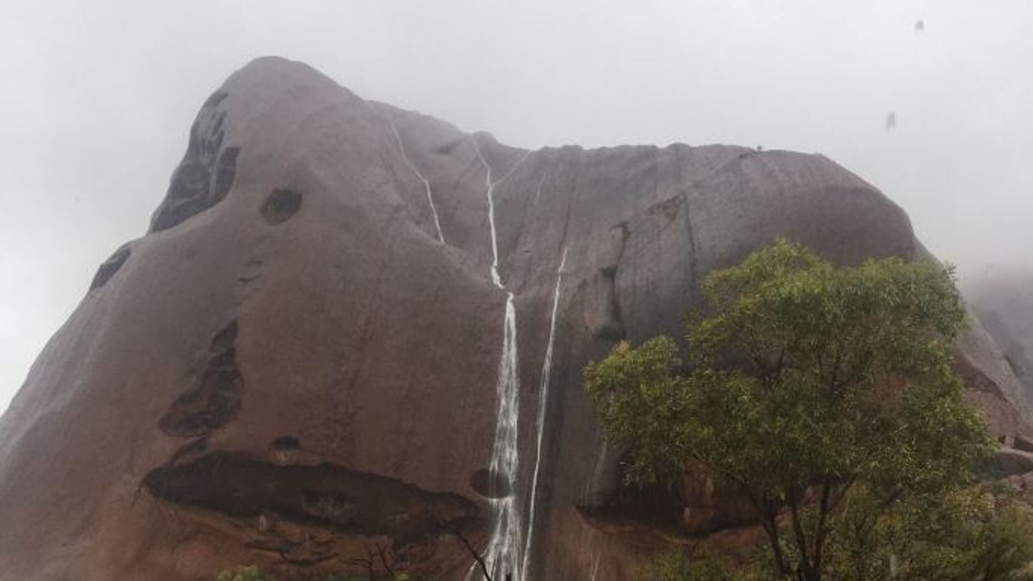 Stunning waterfalls on Uluru after freak storm hits the Australian rock ...