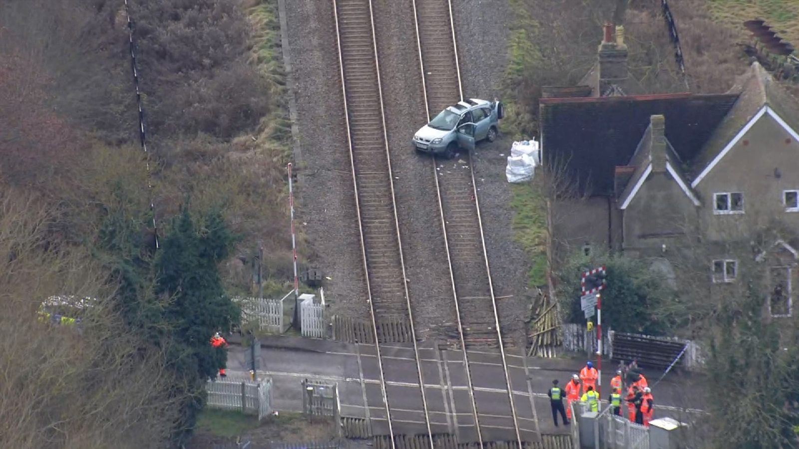 Man killed as car is hit by train at level crossing in Bedfordshire ...