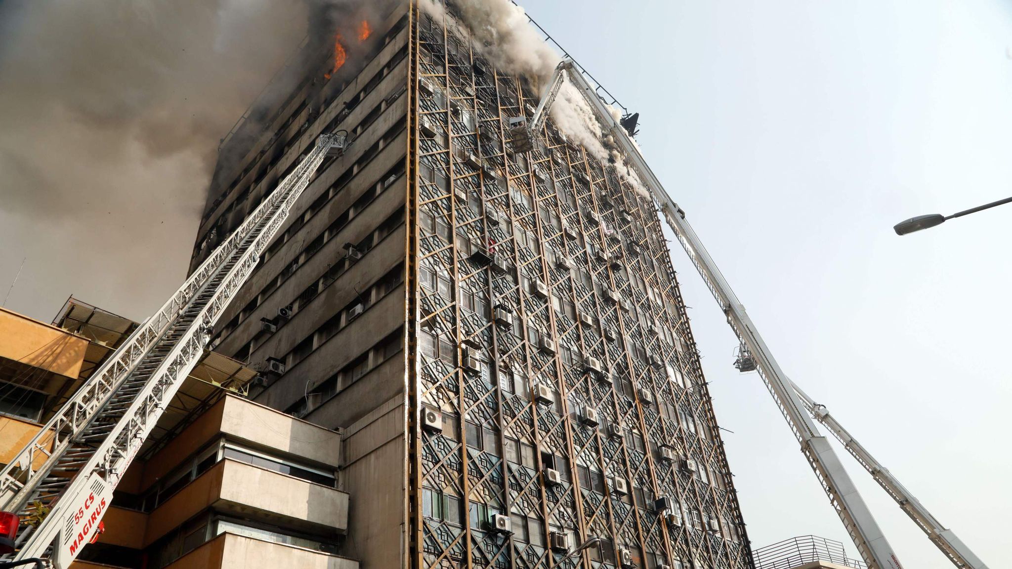 Iran: Iconic Tehran high-rise collapses after fire | World News | Sky News