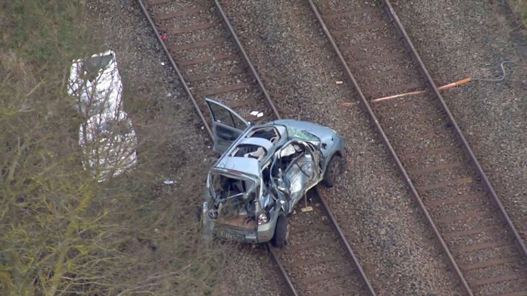 Man killed as car is hit by train at level crossing in Bedfordshire ...