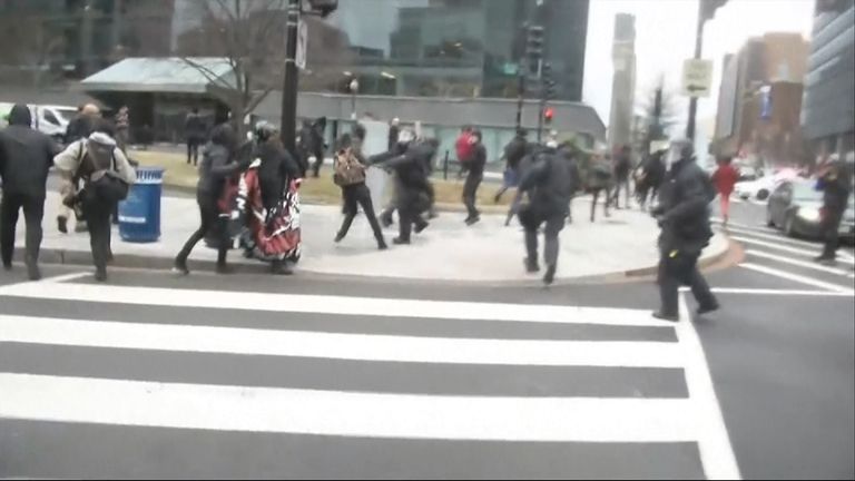 Masked protesters smash windows ahead of inauguration | Scoop News ...