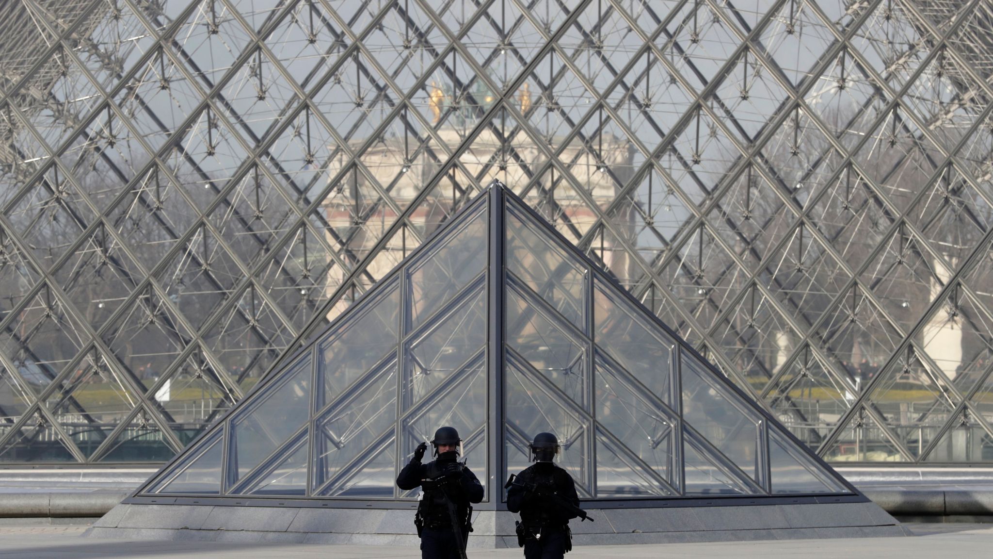 Police raids in Paris after 'terrorist' shot by soldier at Louvre ...