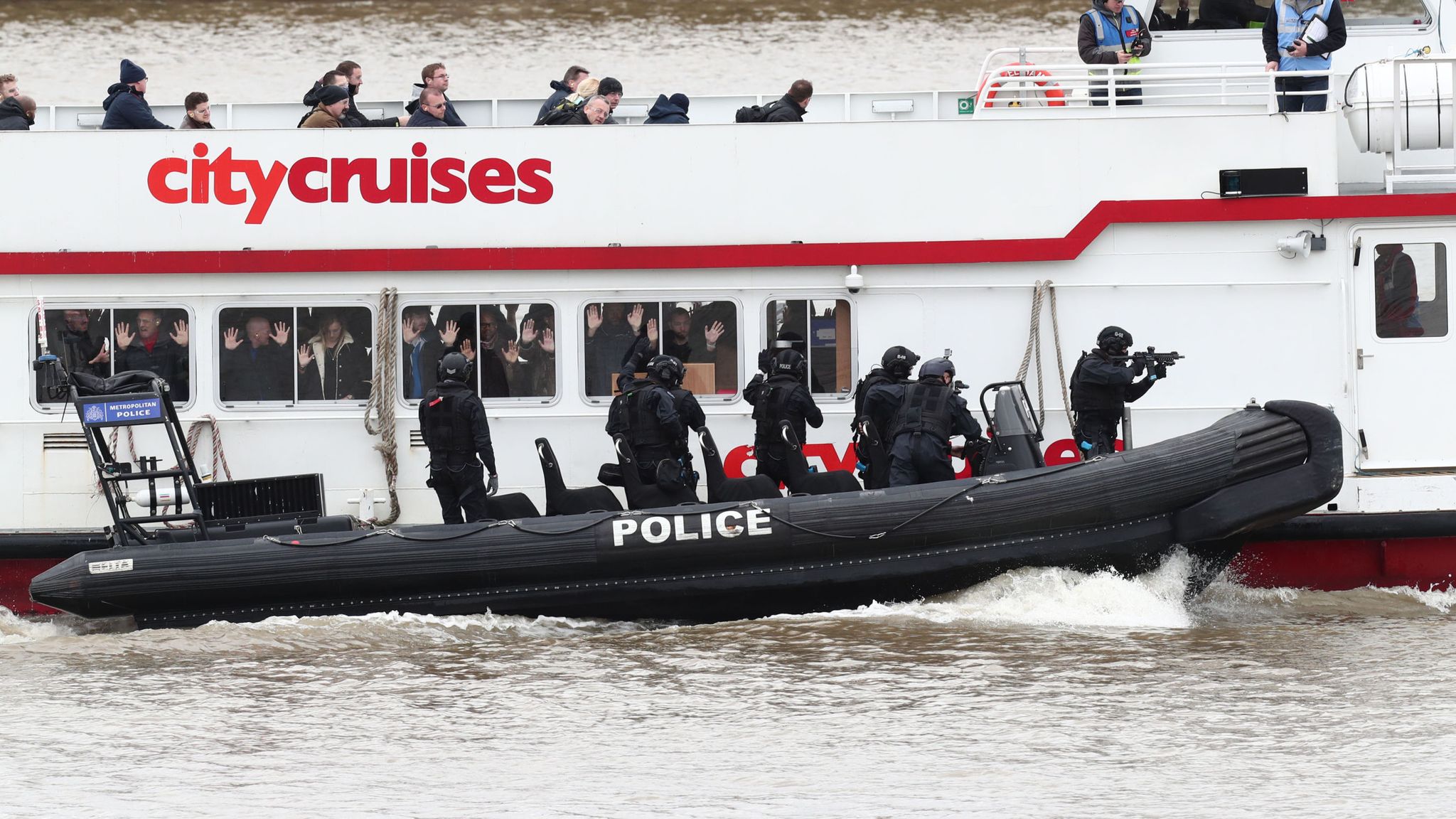 Armed police storm boat in hijack exercise on River Thames | UK News ...