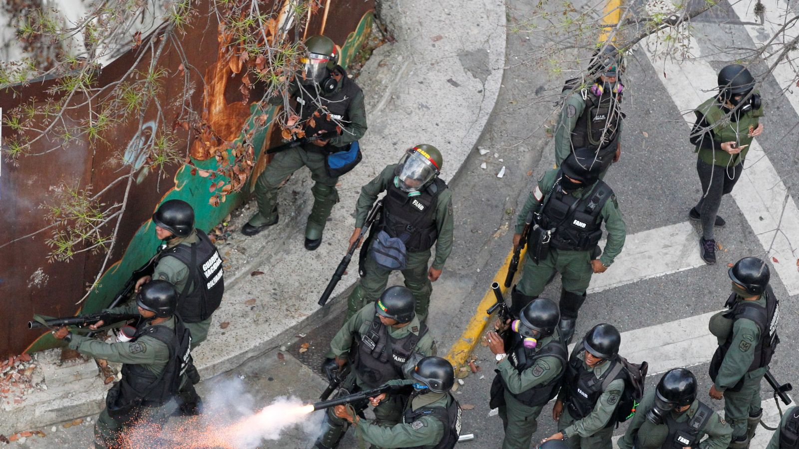 Police clash with protesters in Caracas | World News | Sky News