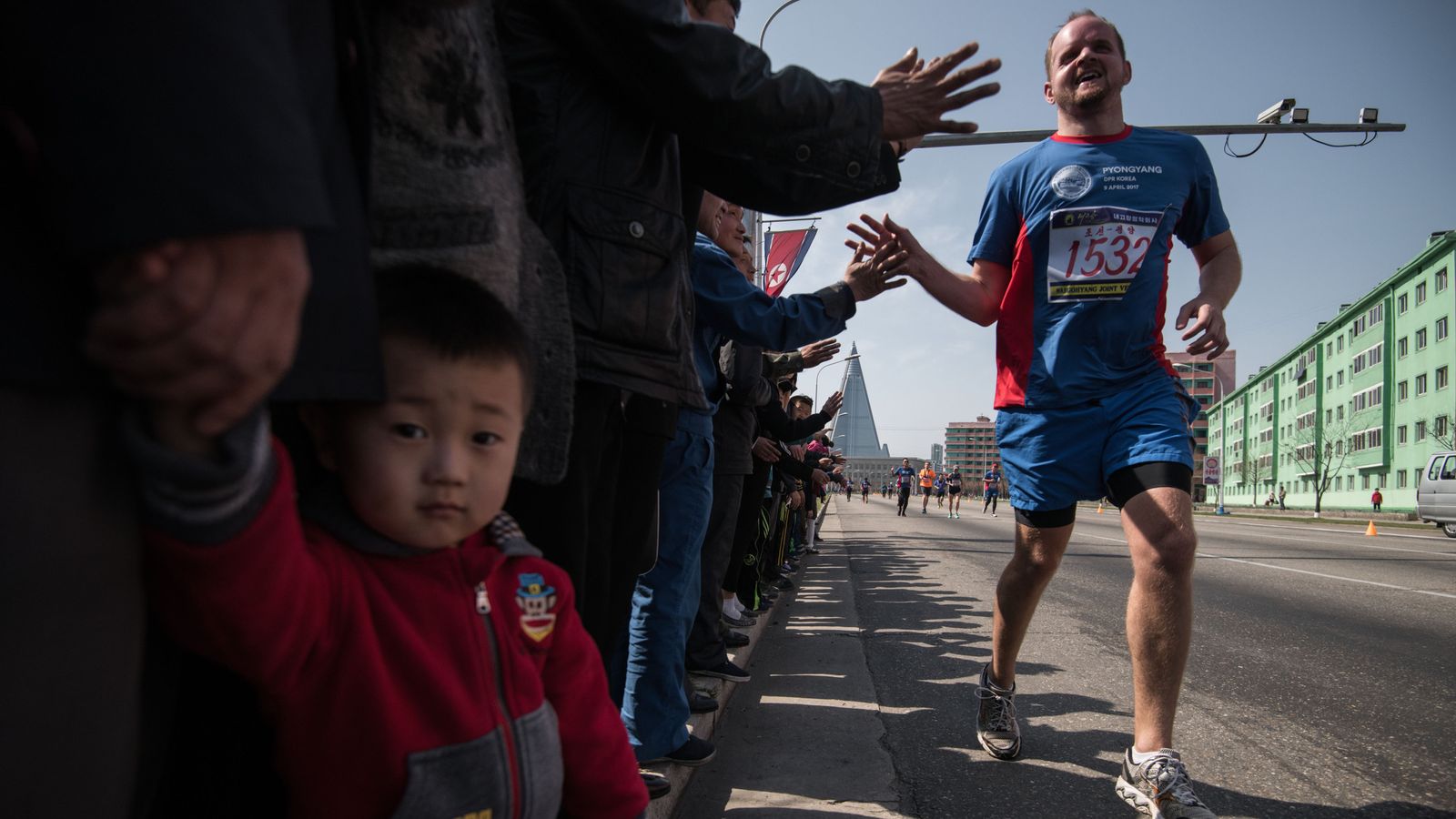 North Koreans high five foreign runners competing in Pyongyang marathon ...