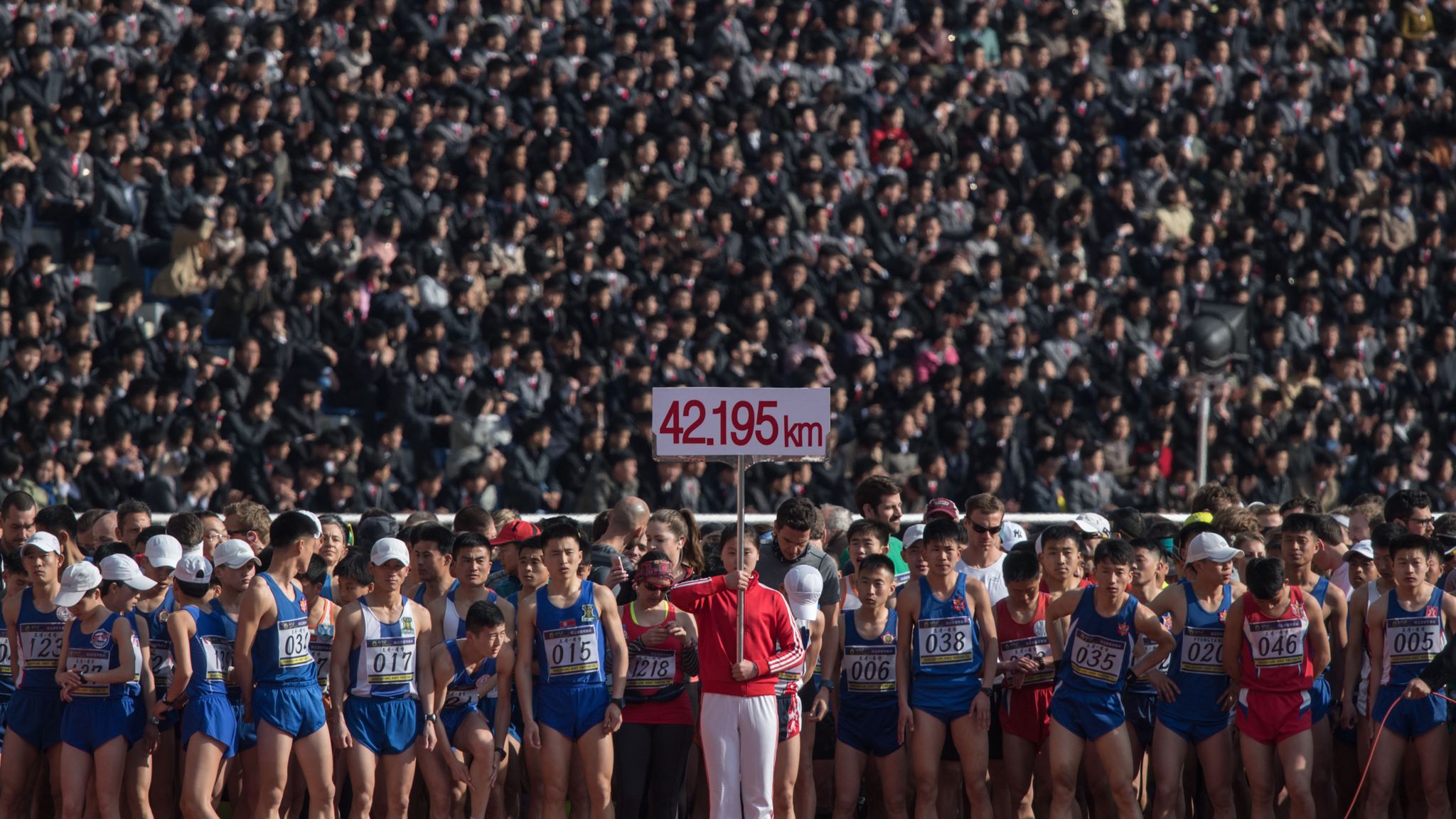 North Koreans high five foreign runners competing in Pyongyang marathon ...