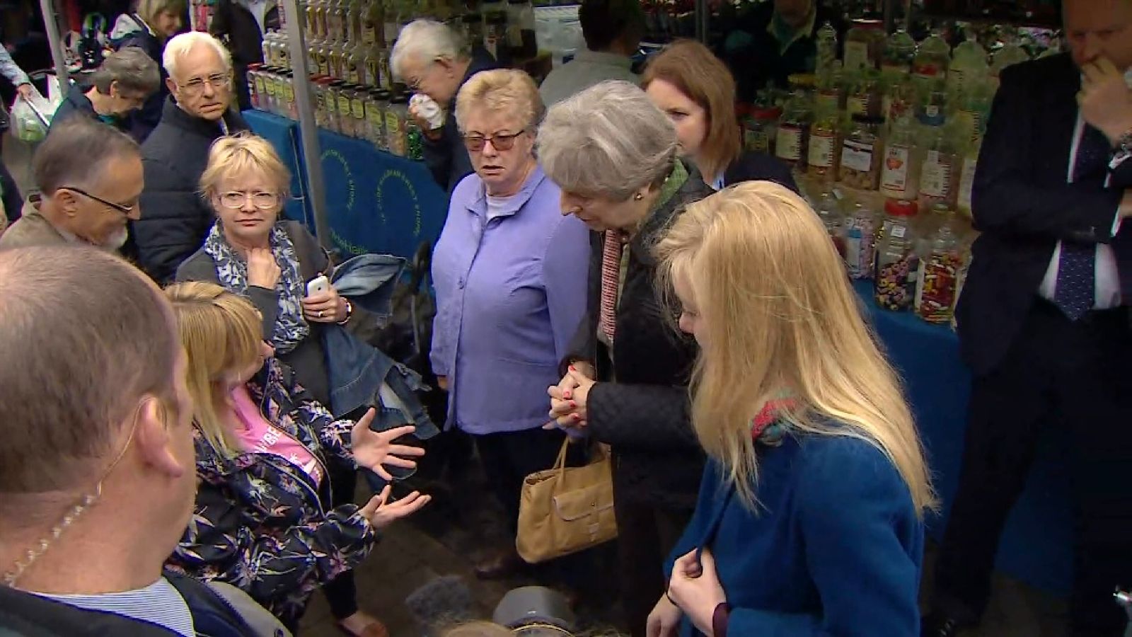 Theresa May confronted by angry woman over disability benefit cuts ...