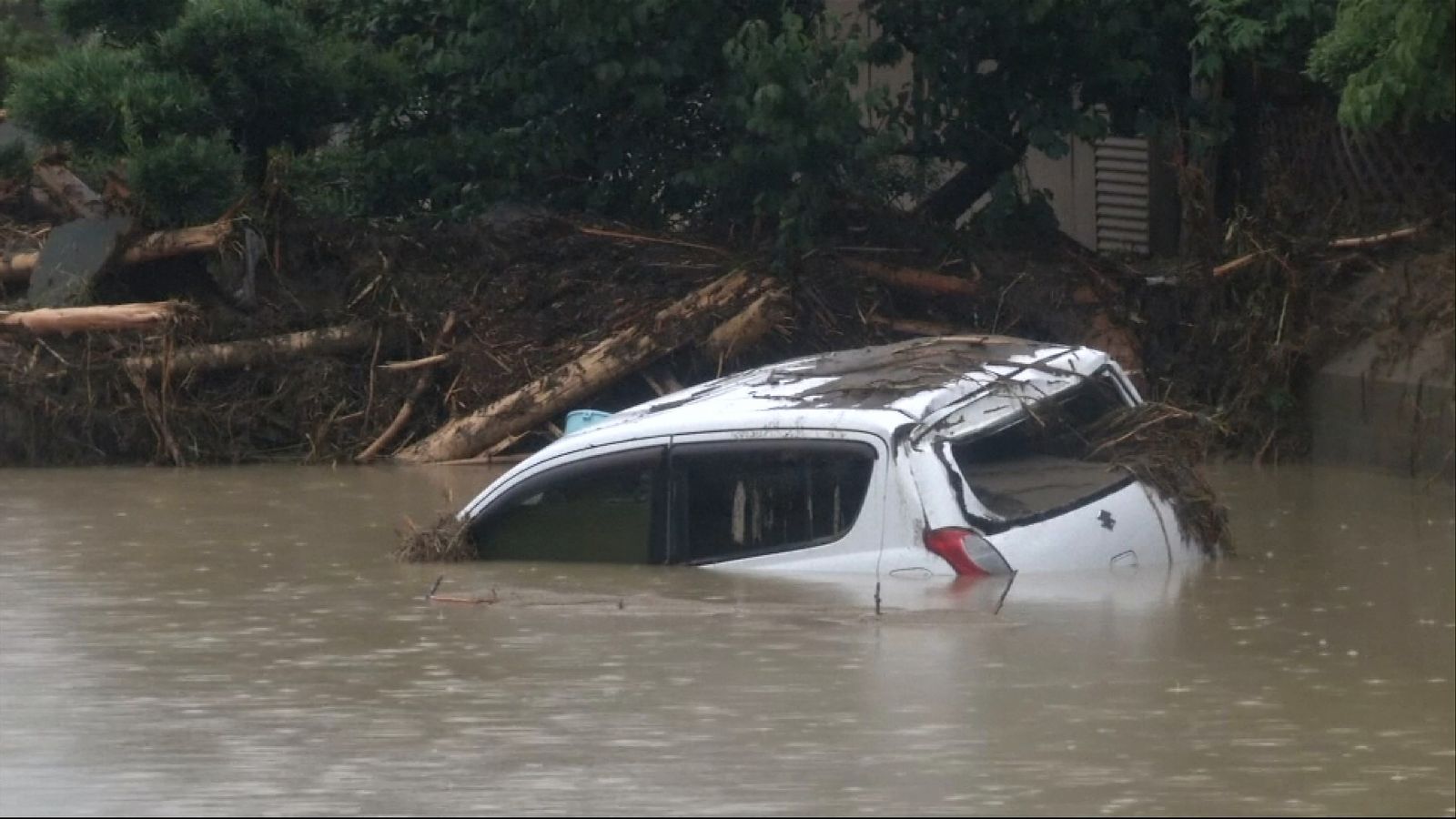 Japan floods wash away homes and vehicles | World News | Sky News