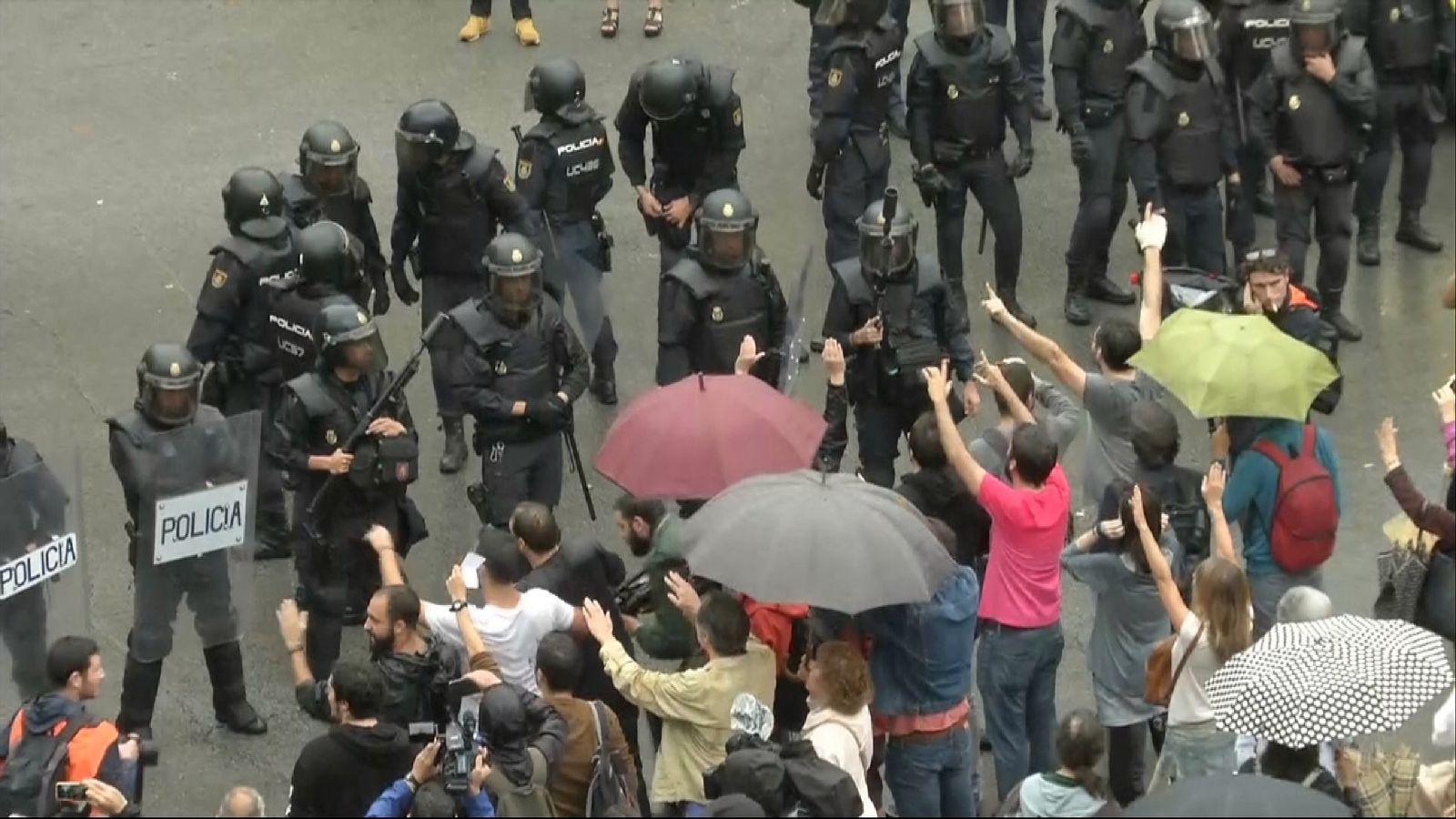 Riot police in stand off as illegal Catalonia independence vote begins ...