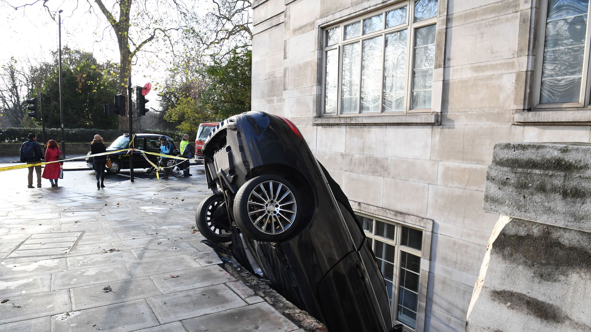 Driver arrested after Mercedes smashes into basement of luxury flat ...
