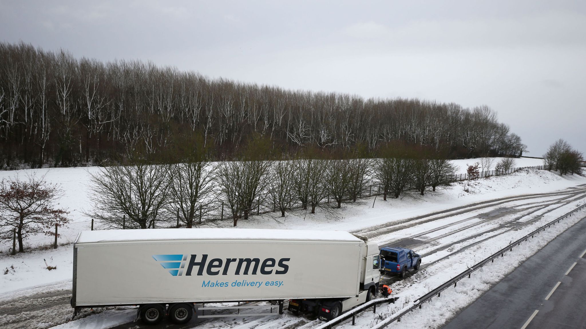 Snow falls on icy UK, causing treacherous conditions and travel ...