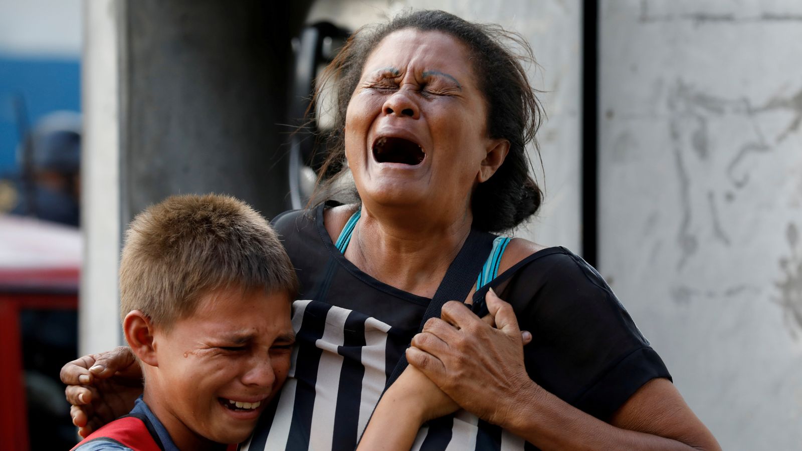Families tear-gassed as 68 prisoners die in fire at jail in Venezuela ...