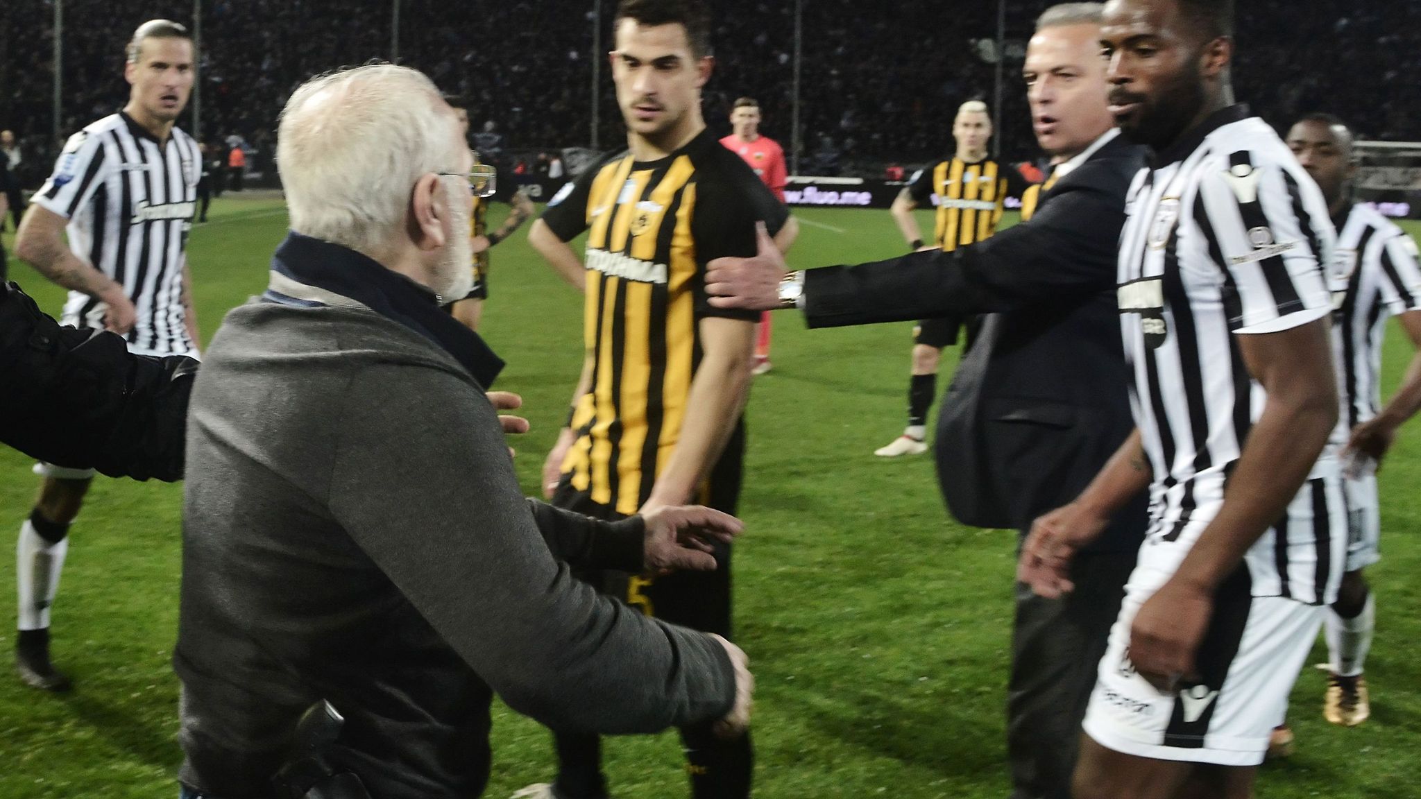 Football match halted as club owner takes gun on to the pitch | World ...