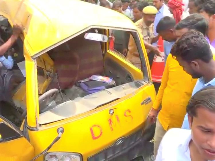 India bus crash: Thirteen children die as school bus hit by train