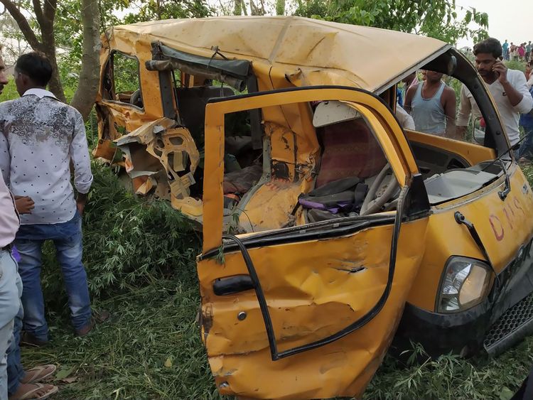 India bus crash: Thirteen children die as school bus hit by train