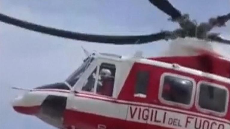 An Italian fire brigade rescue helicopter winched to safety two ...