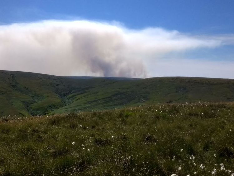 Warm weather reignites wildfires across Saddleworth Moor