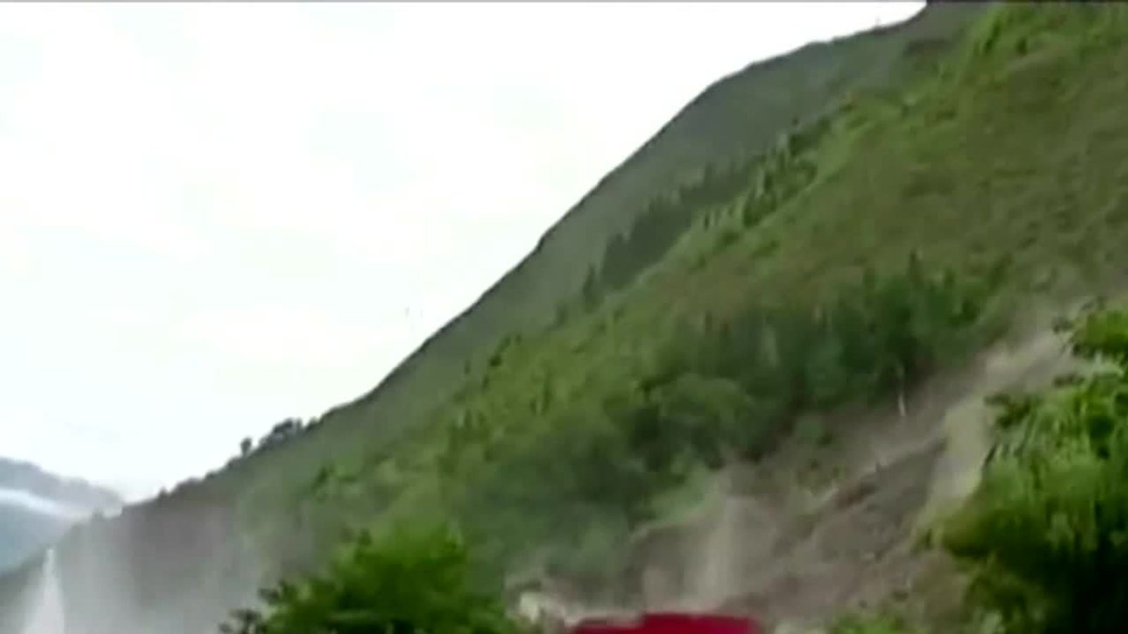 China: Dramatic footage shows rocks falling across a road | News UK ...