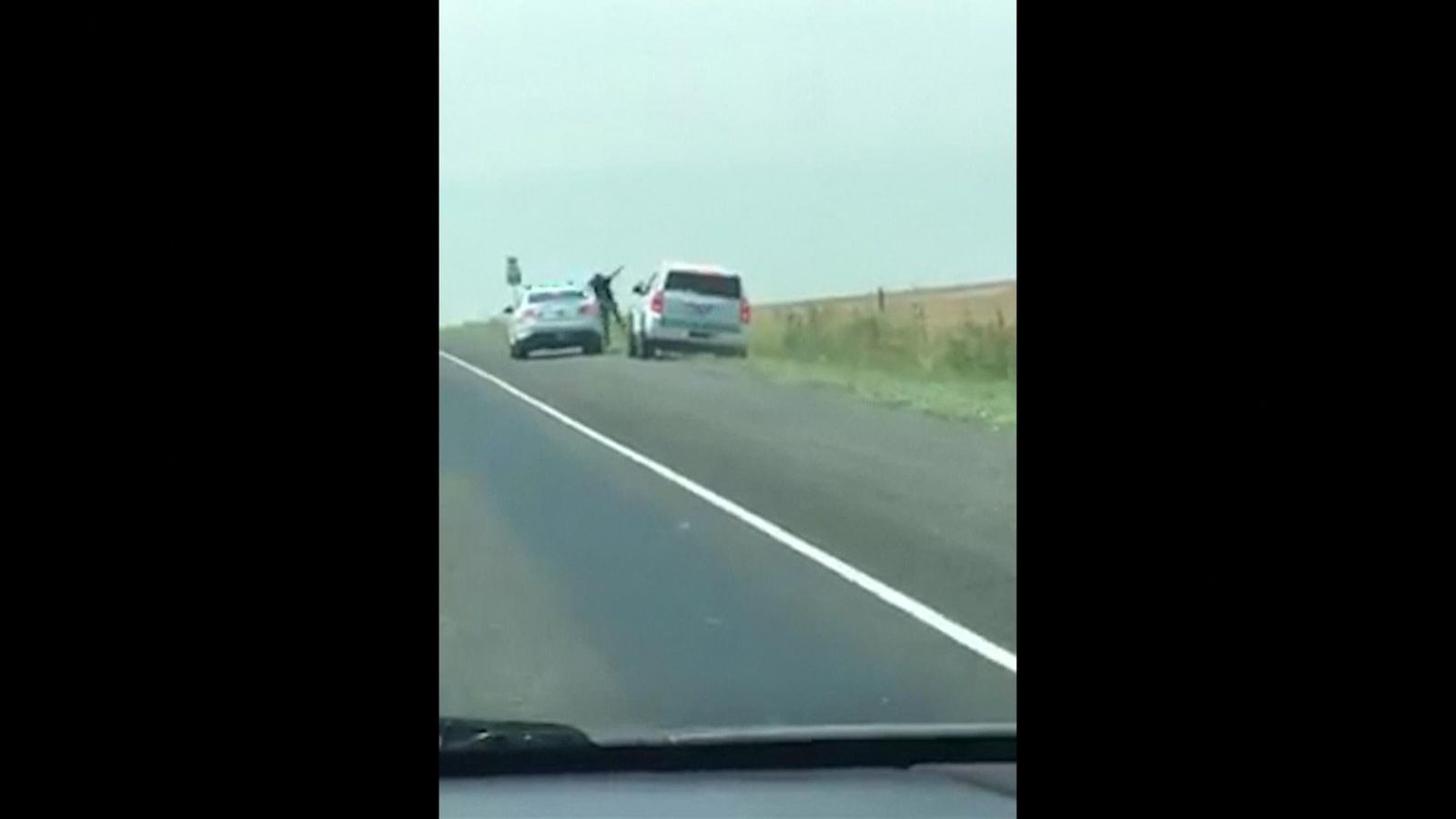 Inmate filmed riding on top of moving police car | World News | Sky News